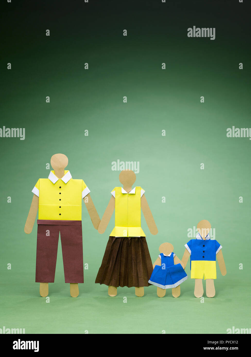 FAMILY OF FOUR USING THE ART OF ORIGAMI Stock Photo - Alamy