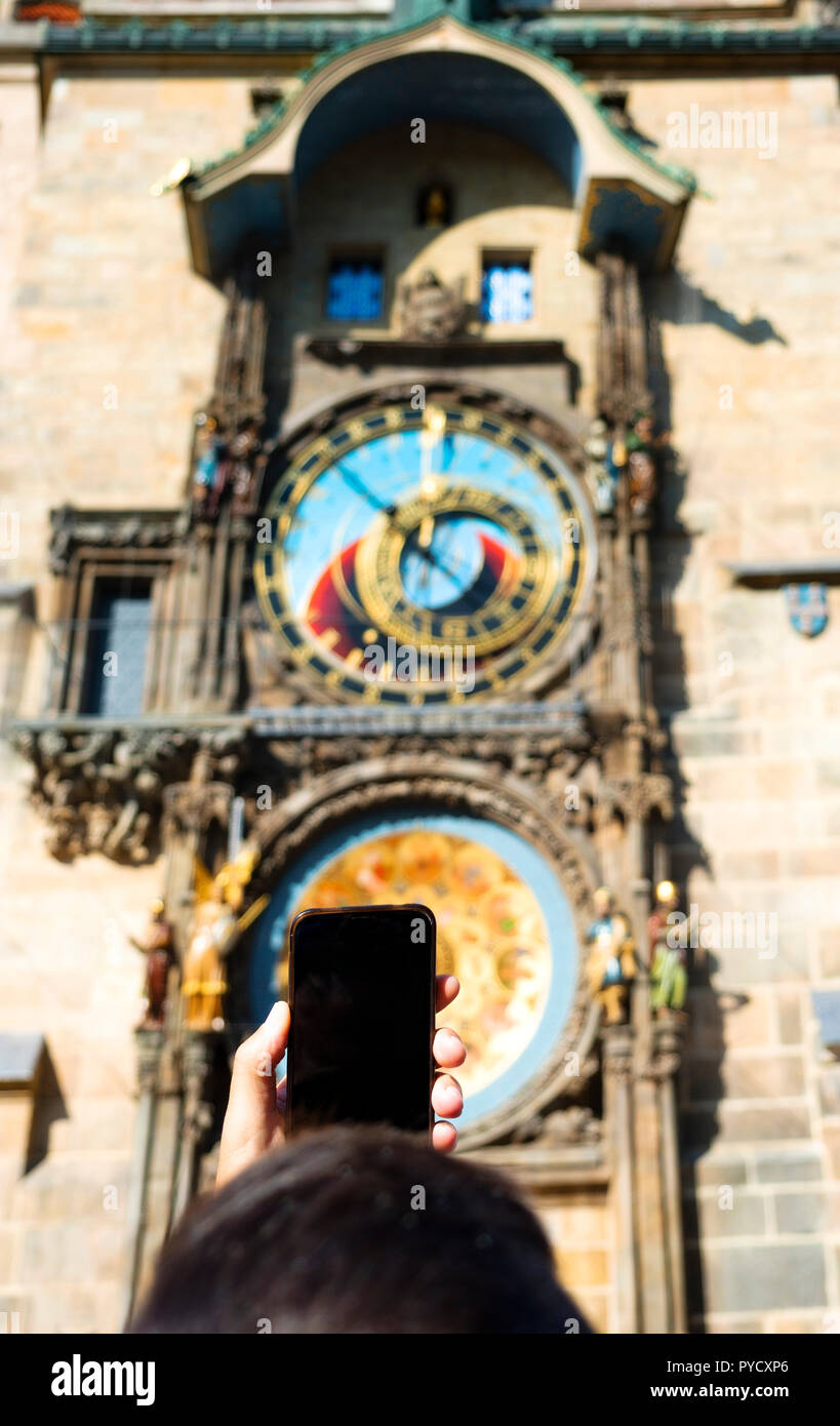 closeup of a young caucasian man, seen from behind, taking a picture of ...