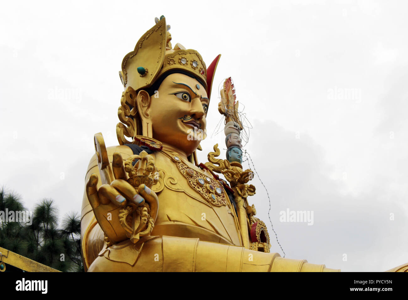 The golden Buddha statues and stupa at Amideva Park on the foothill of ...