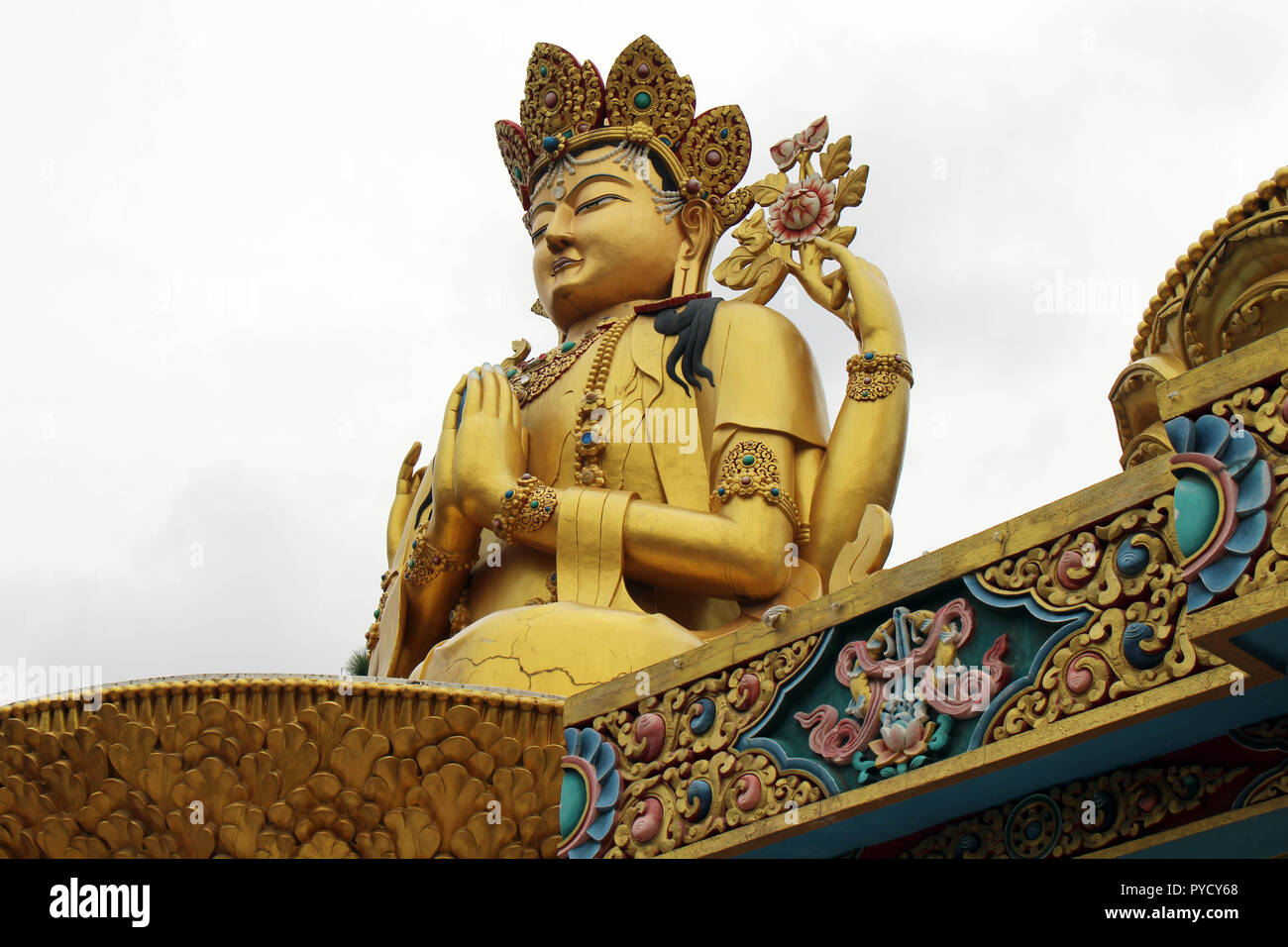 The golden Buddha statues and stupa at Amideva Park on the foothill of ...