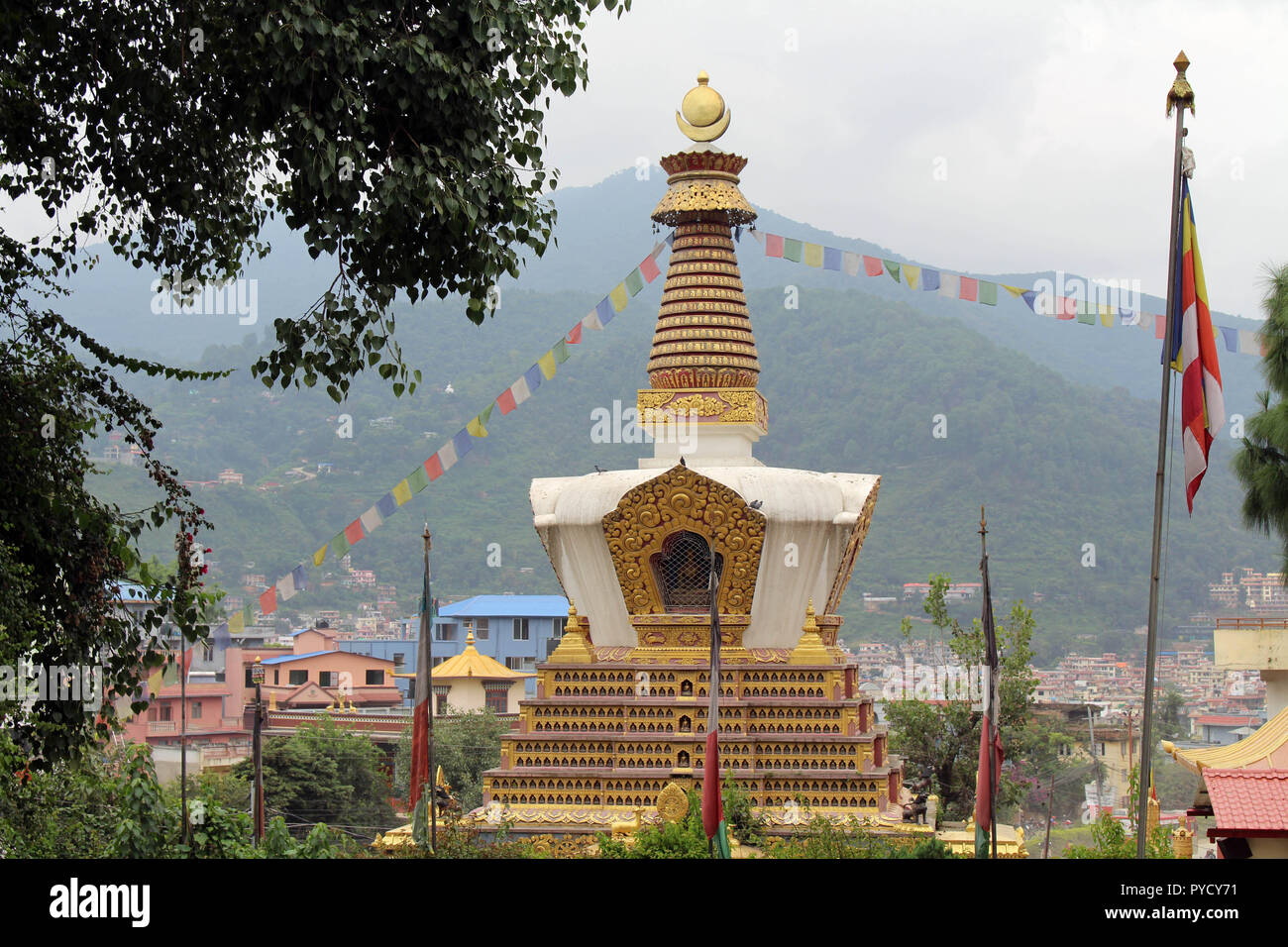 The golden Buddha statues and stupa at Amideva Park on the foothill of ...