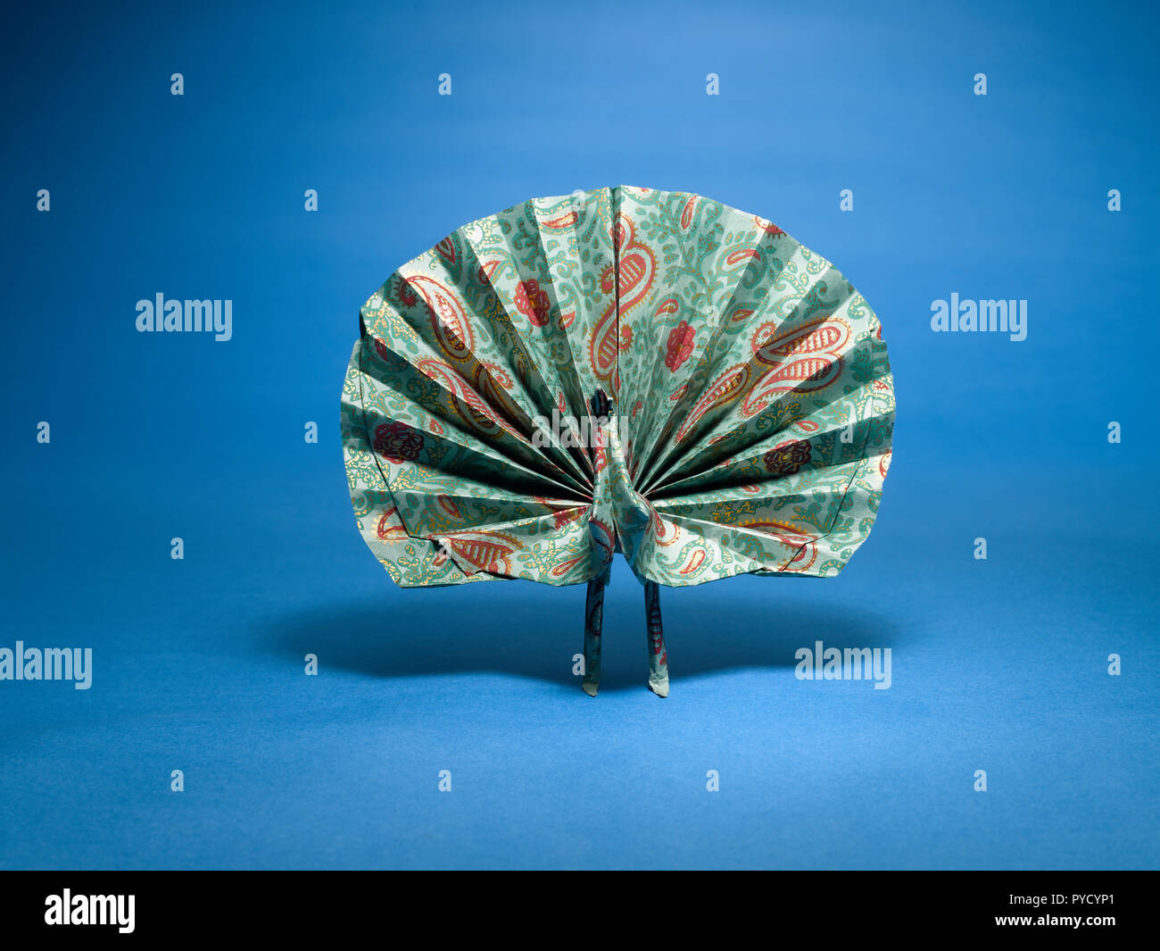 A STILL LIFE OF A PAPER PEACOCK MADE WITH THE ART OF ORIGAMI Stock ...
