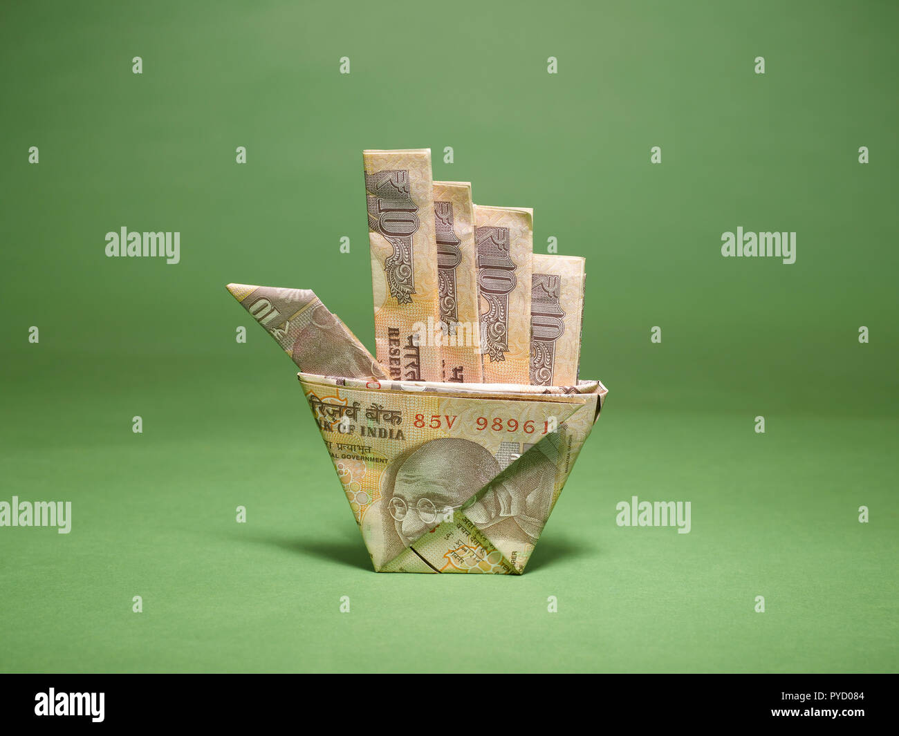 A STILL LIFE OF A HAND MADE WITH CURRENCY NOTES USING THE ART OF ...