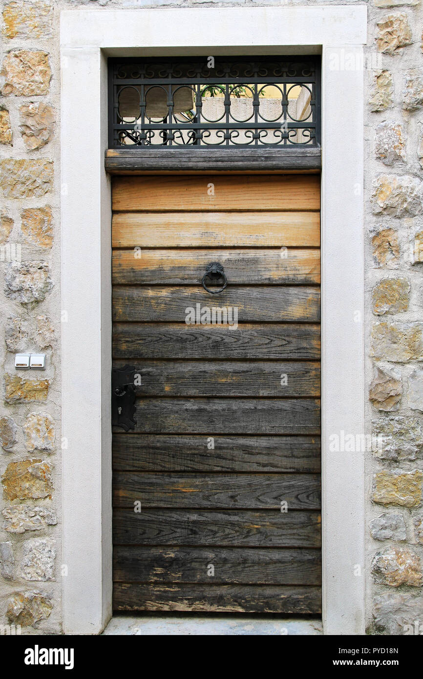 Old and decayed wooden door at medieval house Stock Photo - Alamy