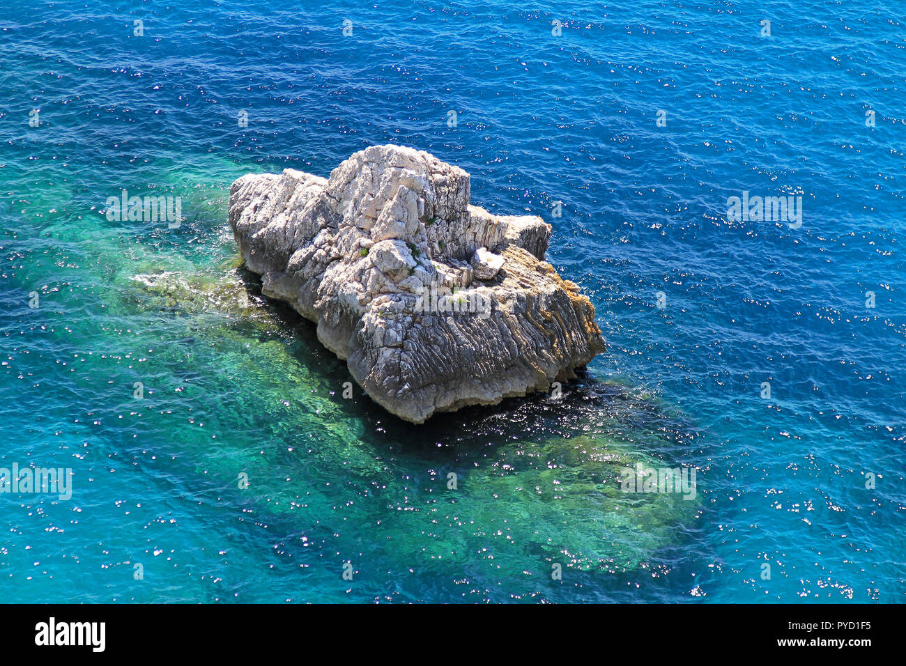 Aerial view of big rock in blue Adriatic sea Stock Photo - Alamy
