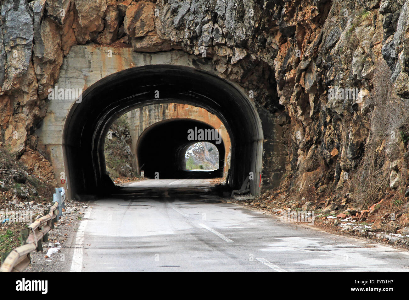 Rough road trough many tunnels in mountain Stock Photo - Alamy