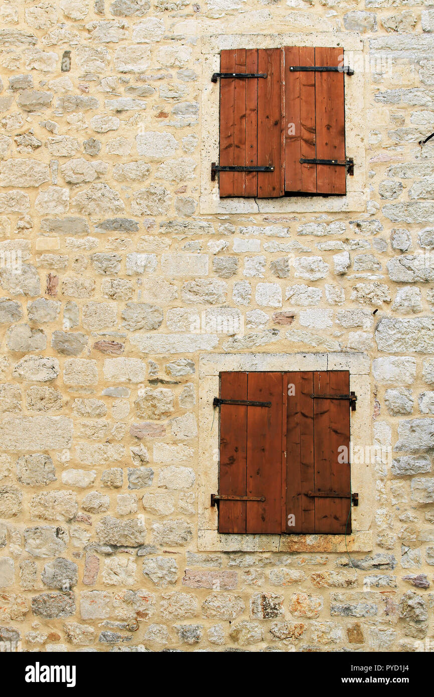 Two closed windows with blinds at old stone house Stock Photo - Alamy