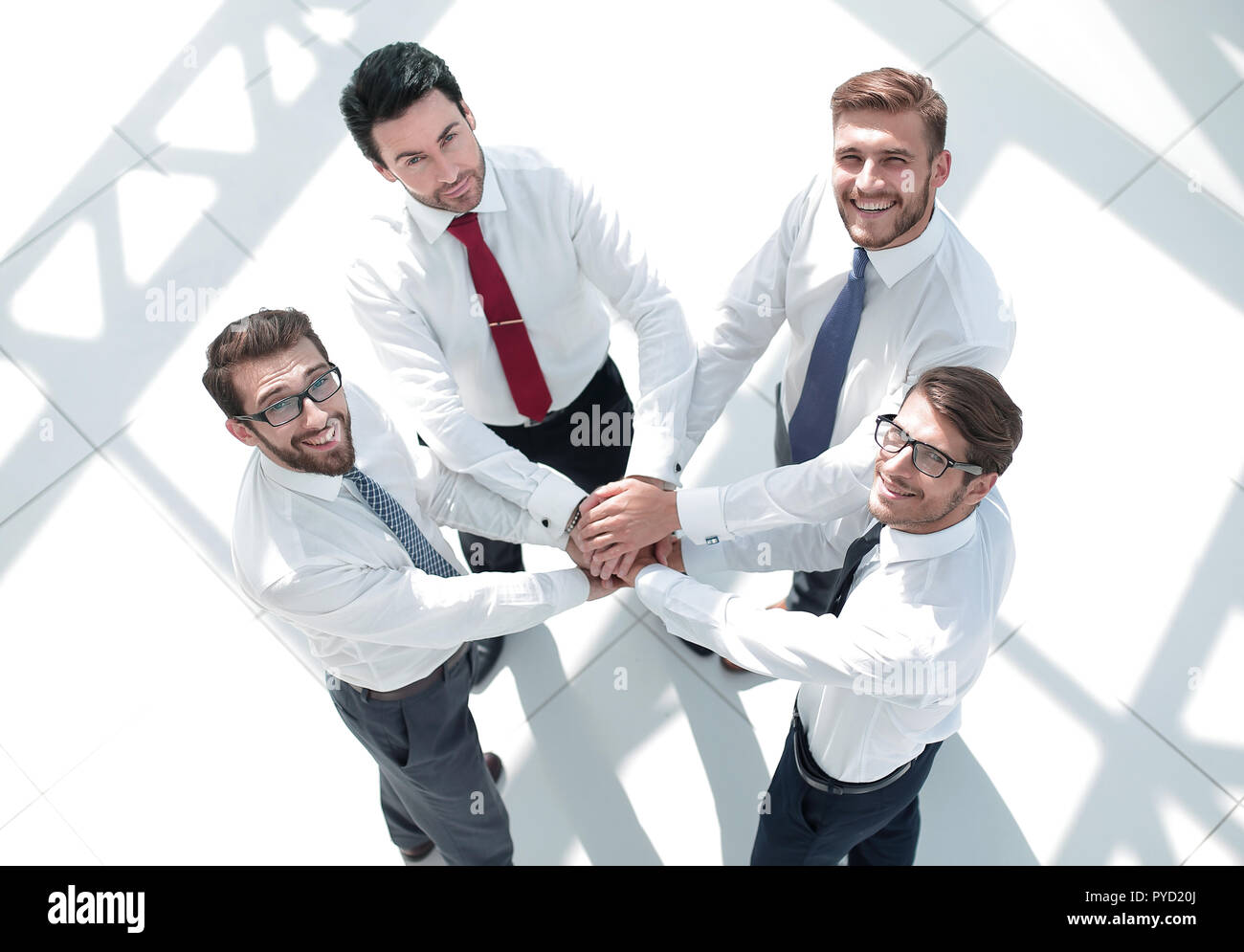 top view. business team putting their hands together Stock Photo - Alamy
