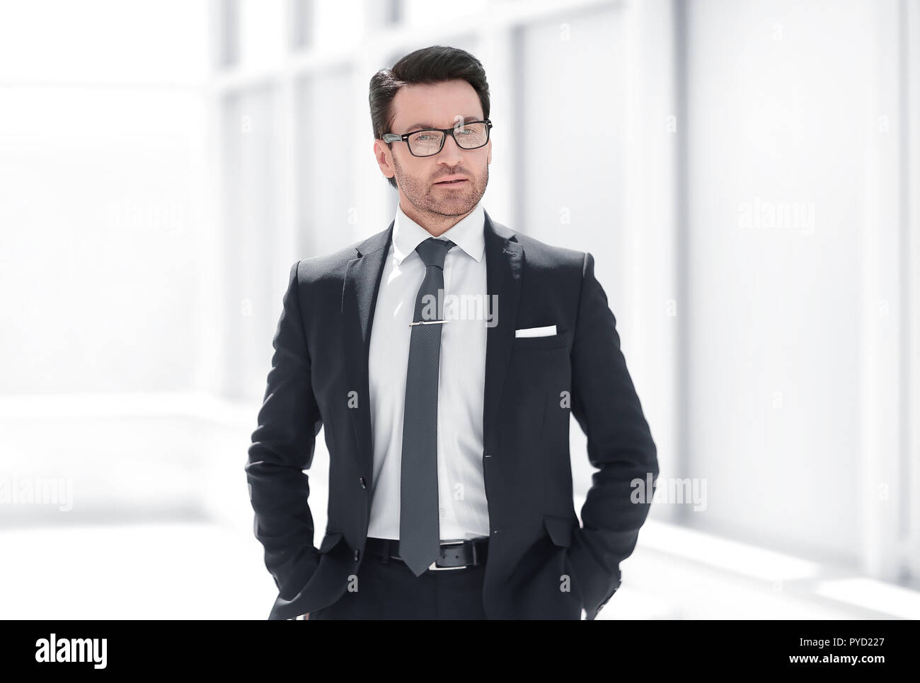 beautiful businessman in the office background Stock Photo - Alamy