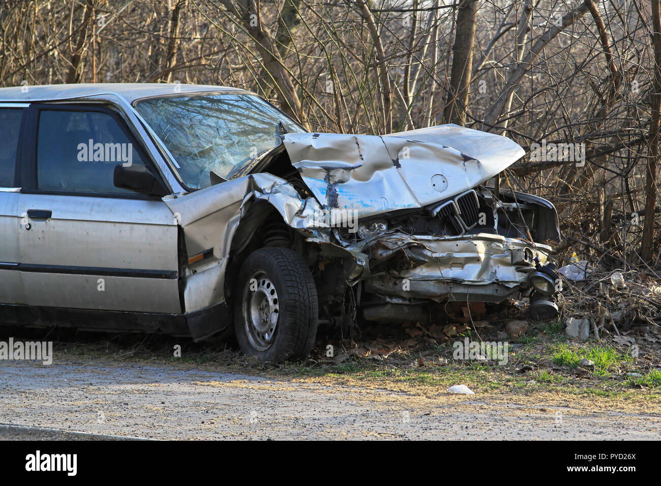 Crushed car in front collision traffic accident Stock Photo - Alamy