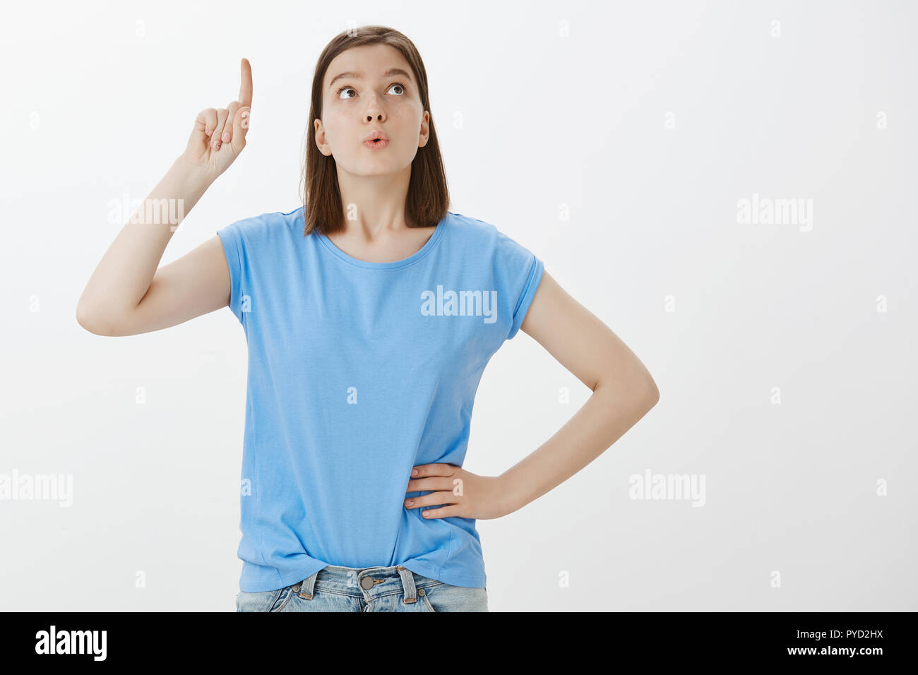 Girl think up awesome solution. Cute adult woman in blue t-shirt ...