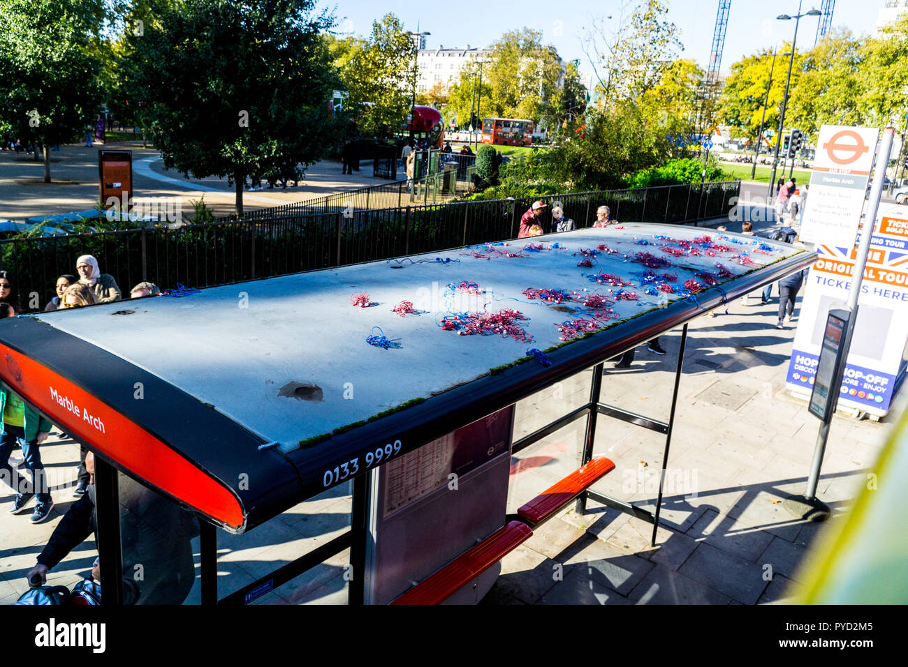 A bus stop where riders on the HOHO bus throw their ear buds on top ot ...