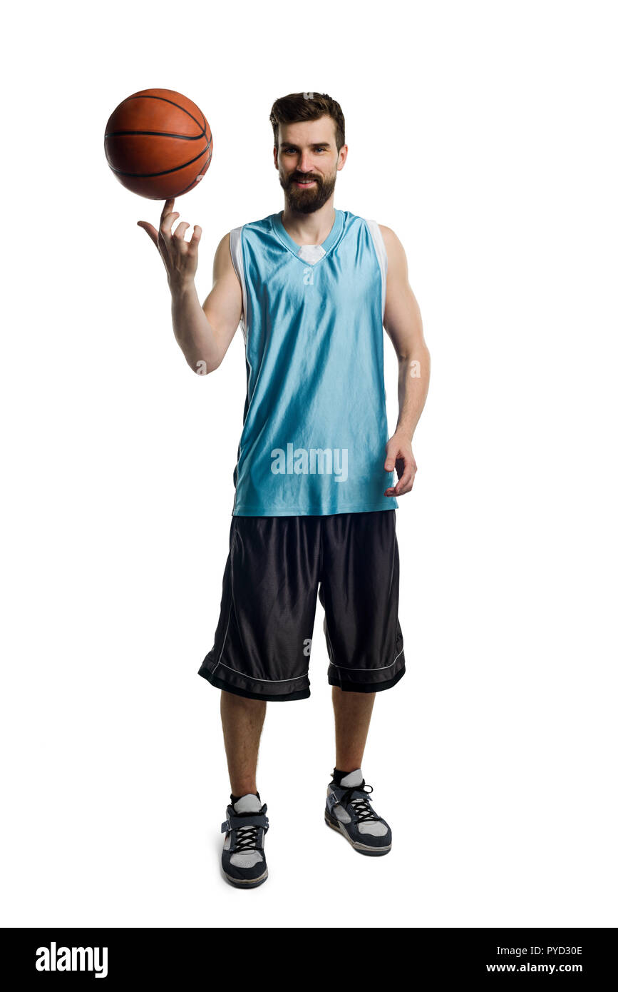 Basketball player spinning a ball Stock Photo - Alamy
