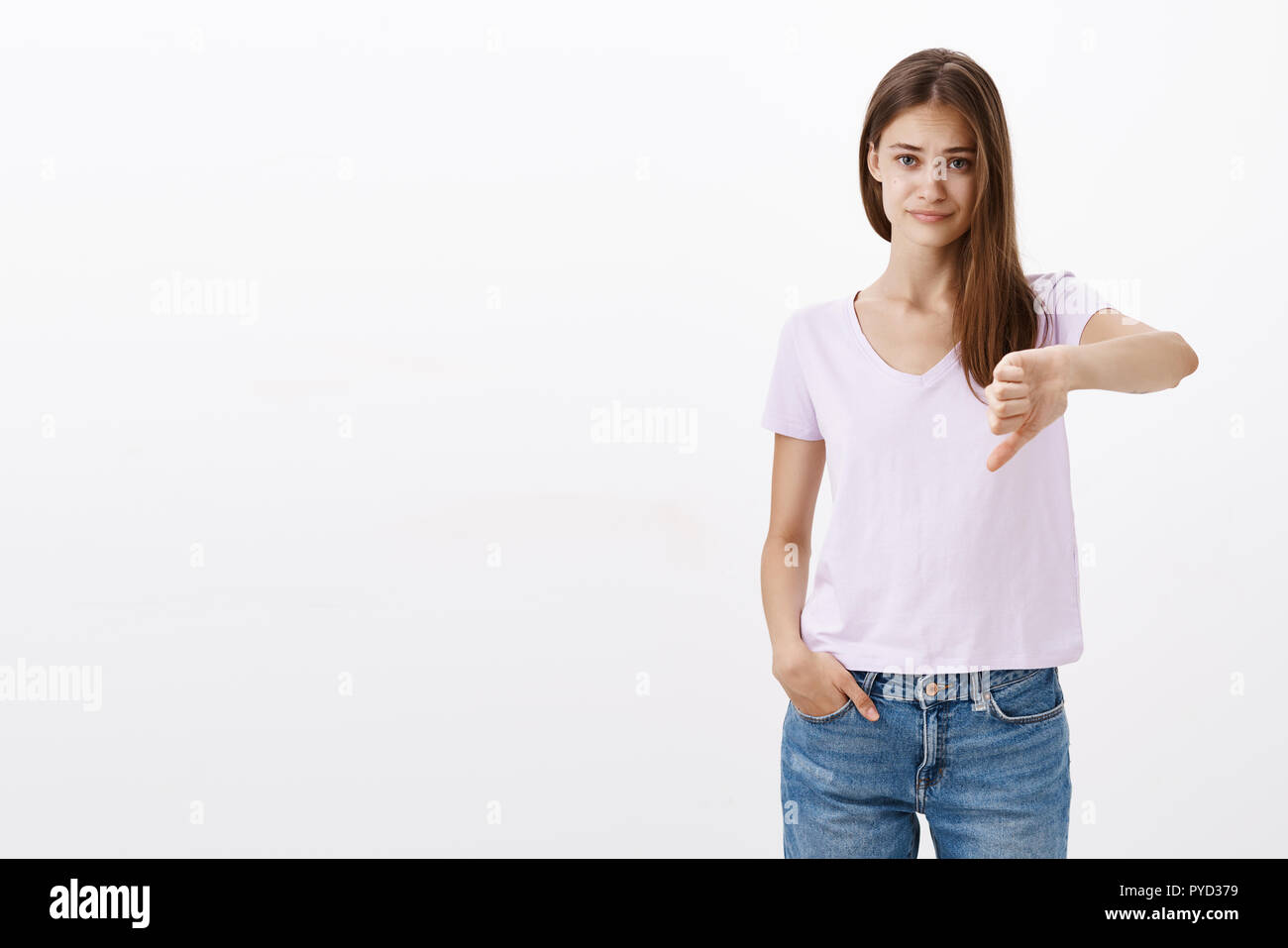 Woman expressing negative opinion giving bad feedback. Displeased and ...