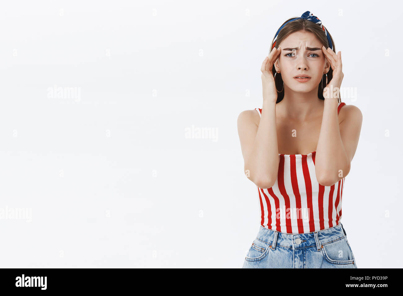 Mind go round. Concerned worried silly woman with attractive body in ...