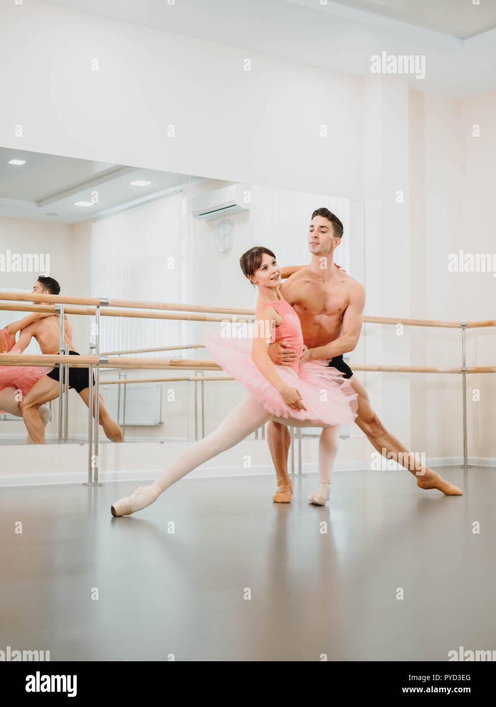 Professional, emotional ballet dancers practicing in the gym or hall ...