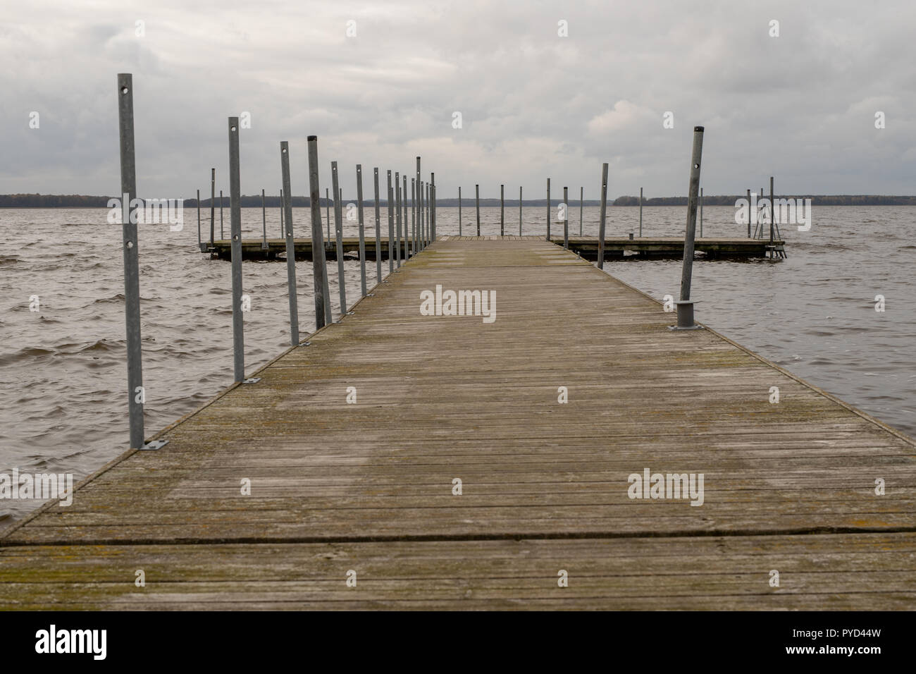 An old bridge over the lake. A place for mooring vessels. Season of the ...