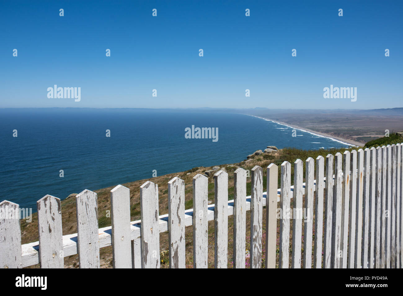White picket fence and the Point Reyes National Seashore shoreline of ...