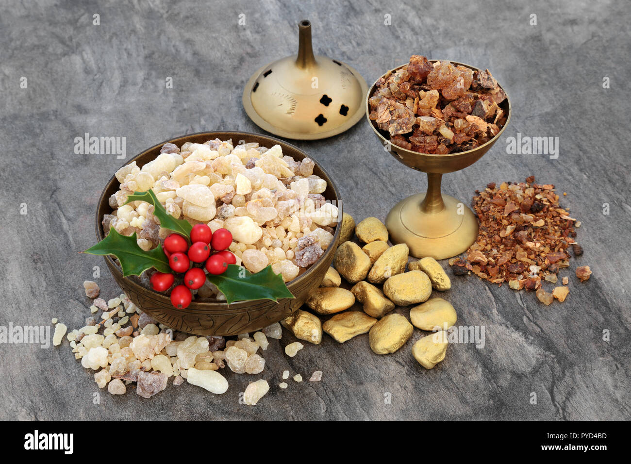 Gold frankincense and myrrh with holly, religious concept of gifts of ...