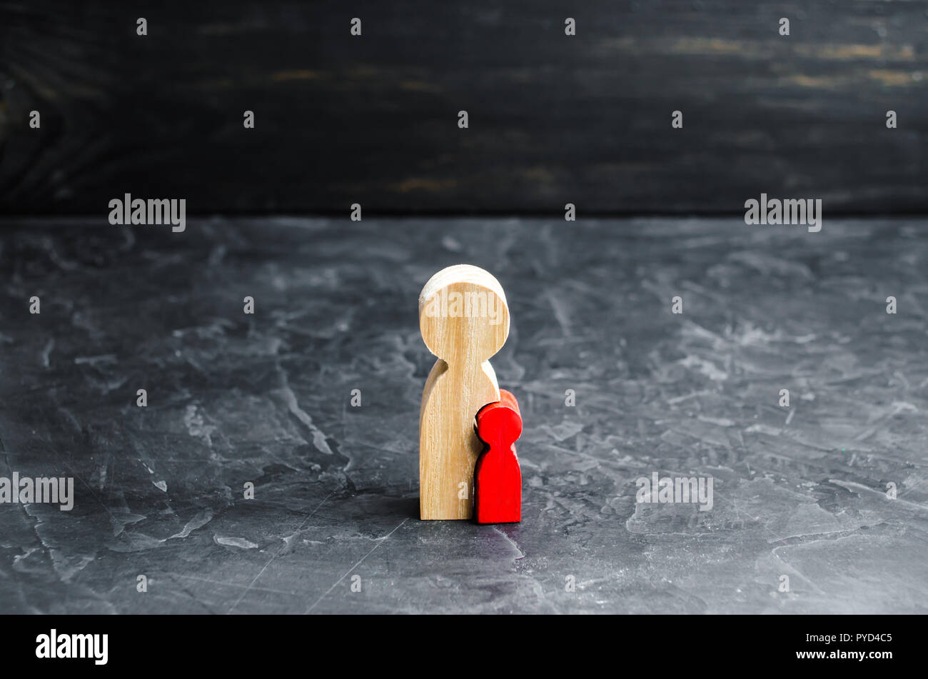 Wooden figure of mother and child. Education and guardianship of ...