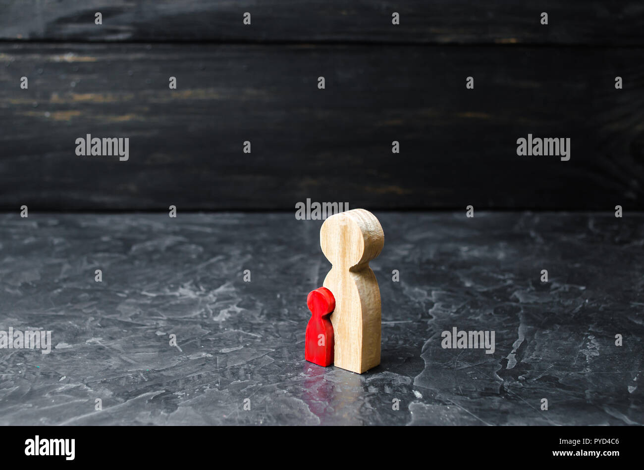 Wooden figure of mother and child. Concept of pregnancy, childbirth and ...