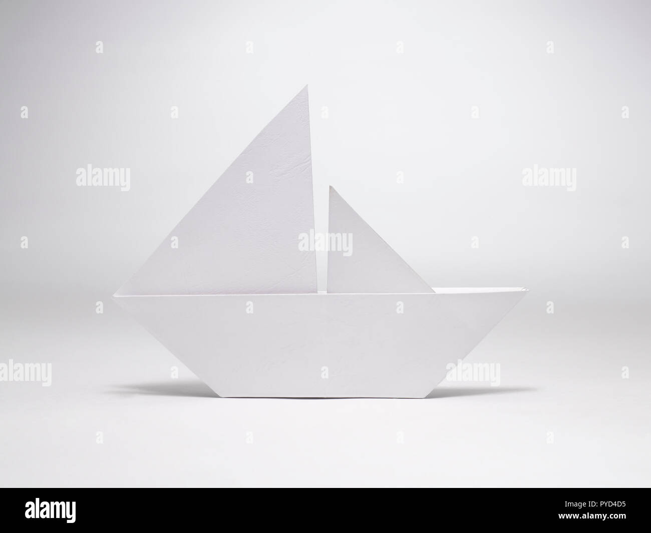 A STILL LIFE OF A PAPER SAIL BOAT MADE WITH THE ART OF ORIGAMI Stock ...