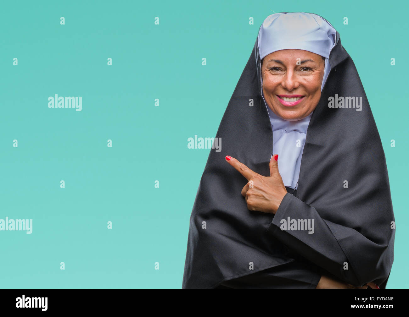 Middle age senior christian catholic nun woman over isolated background ...