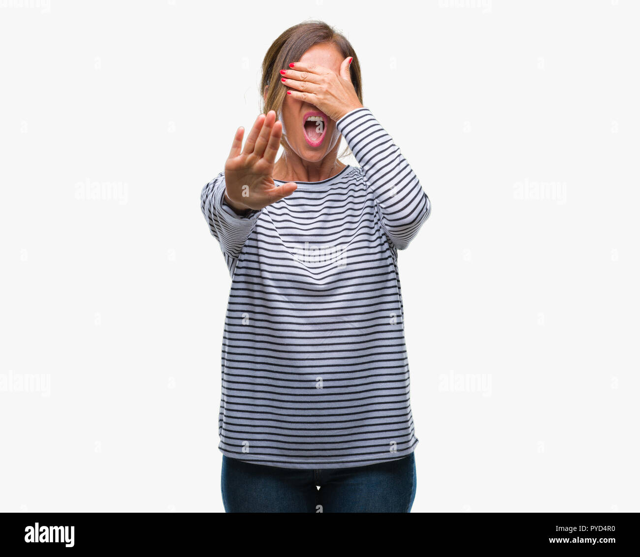Middle age senior hispanic woman over isolated background covering eyes ...