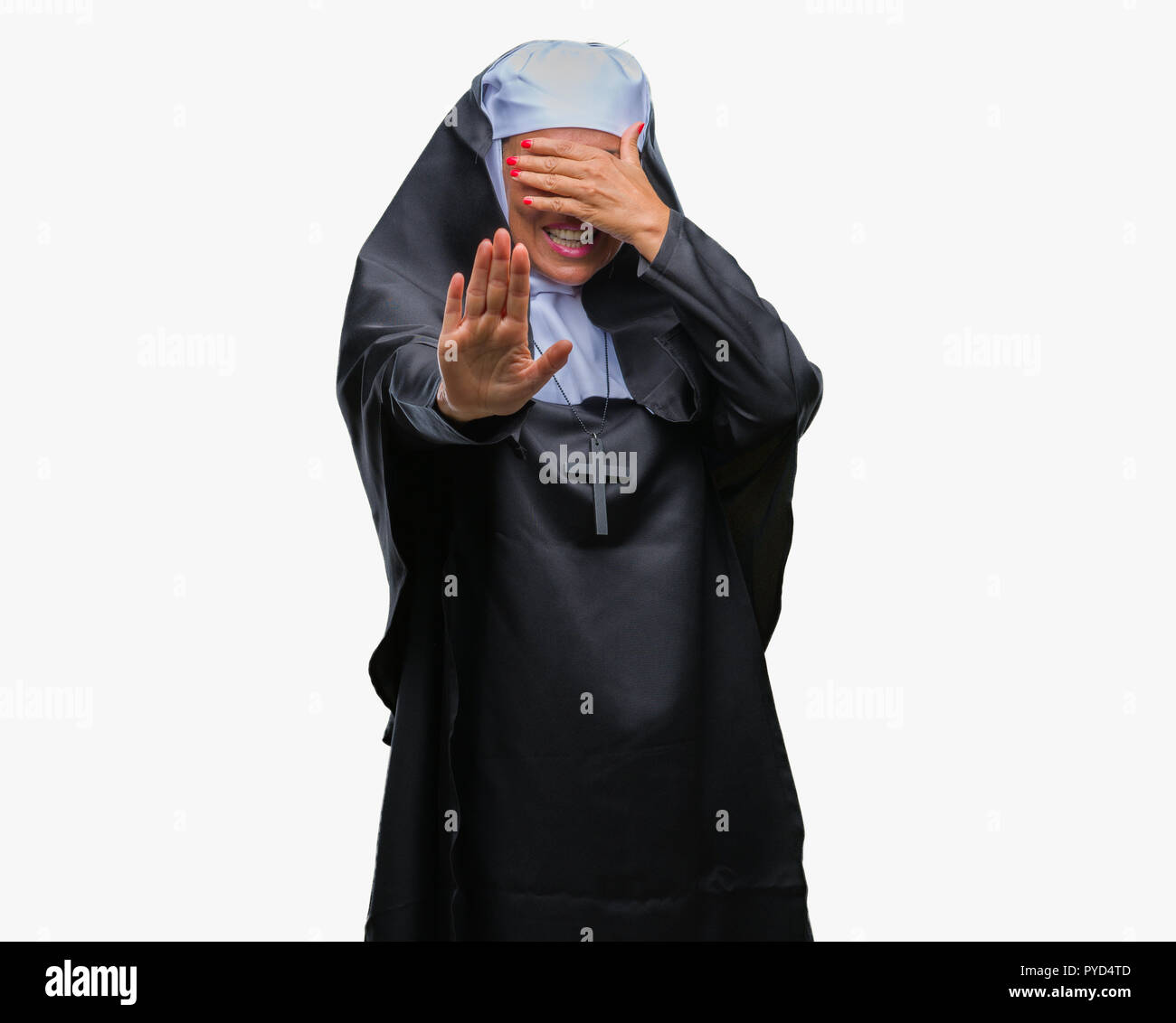 Middle age senior christian catholic nun woman over isolated background ...