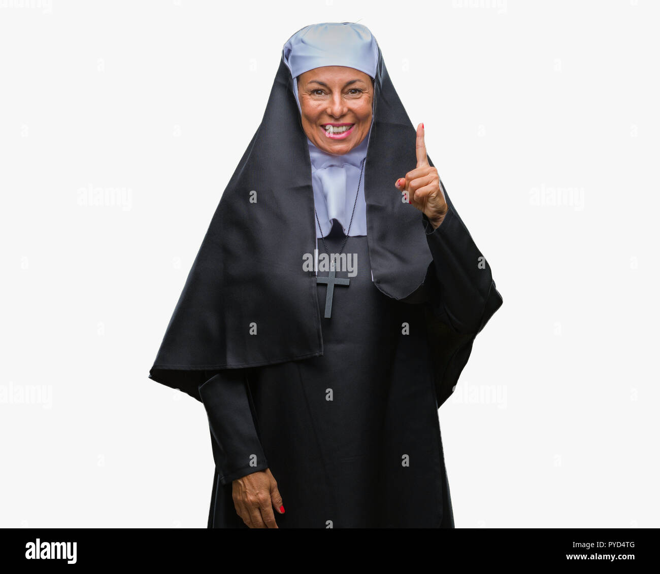 Middle age senior christian catholic nun woman over isolated background ...