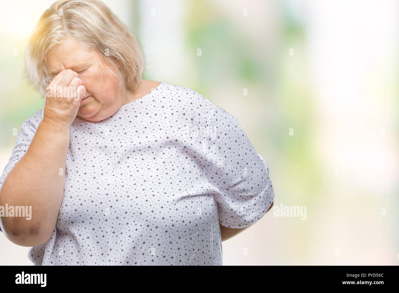 Senior plus size caucasian woman over isolated background tired rubbing ...