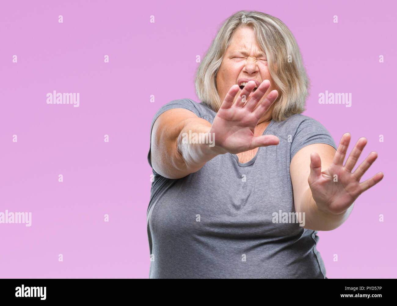 Senior plus size caucasian woman over isolated background afraid and ...