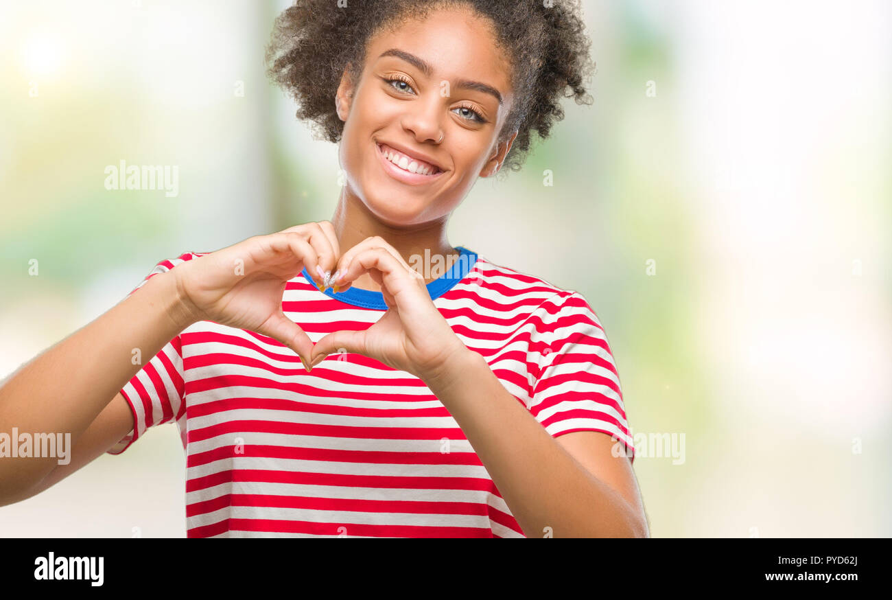 Young afro american woman over isolated background smiling in love ...
