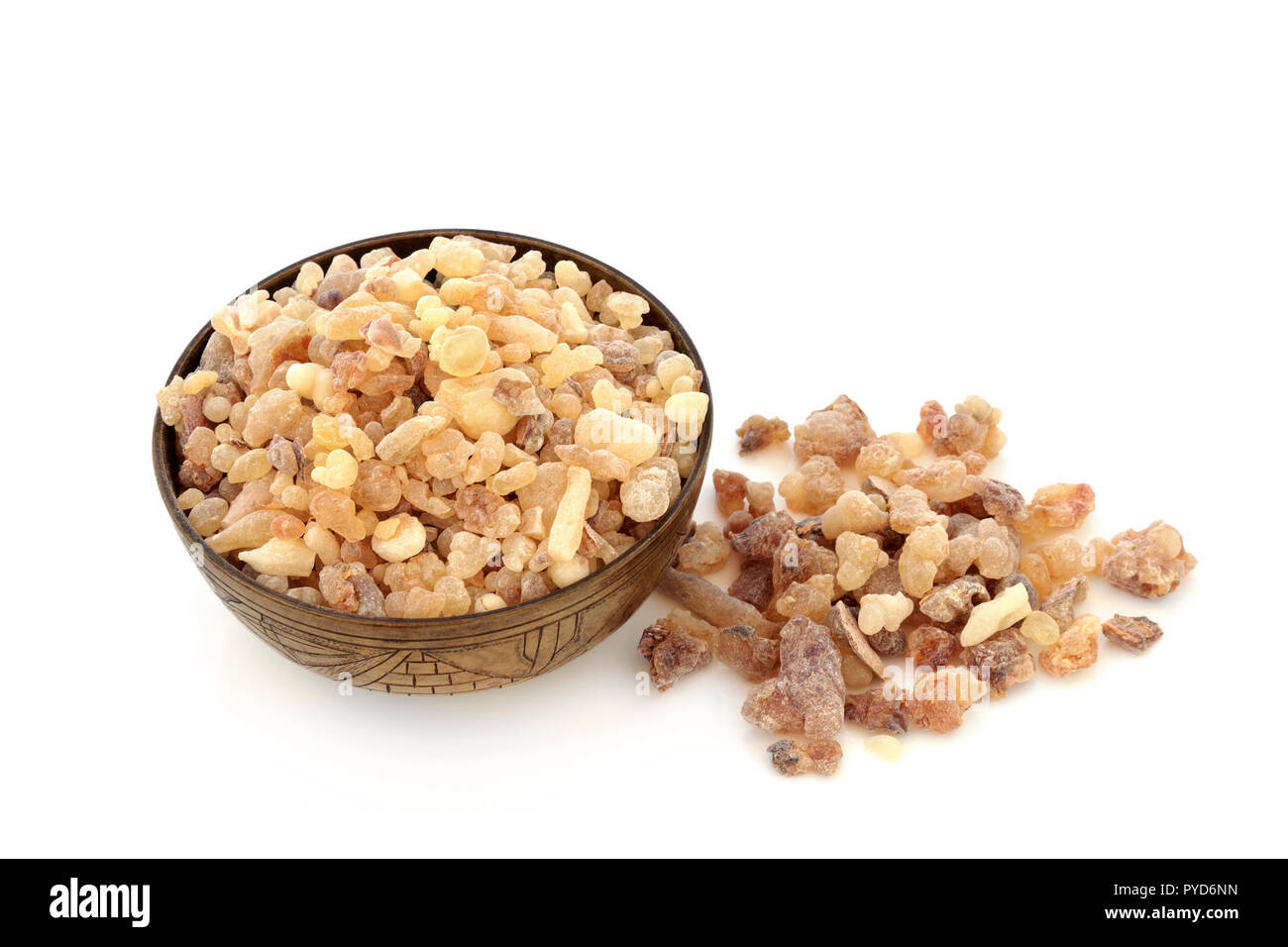 Frankincense aromatic gum resin in an old metal bowl and loose on white ...