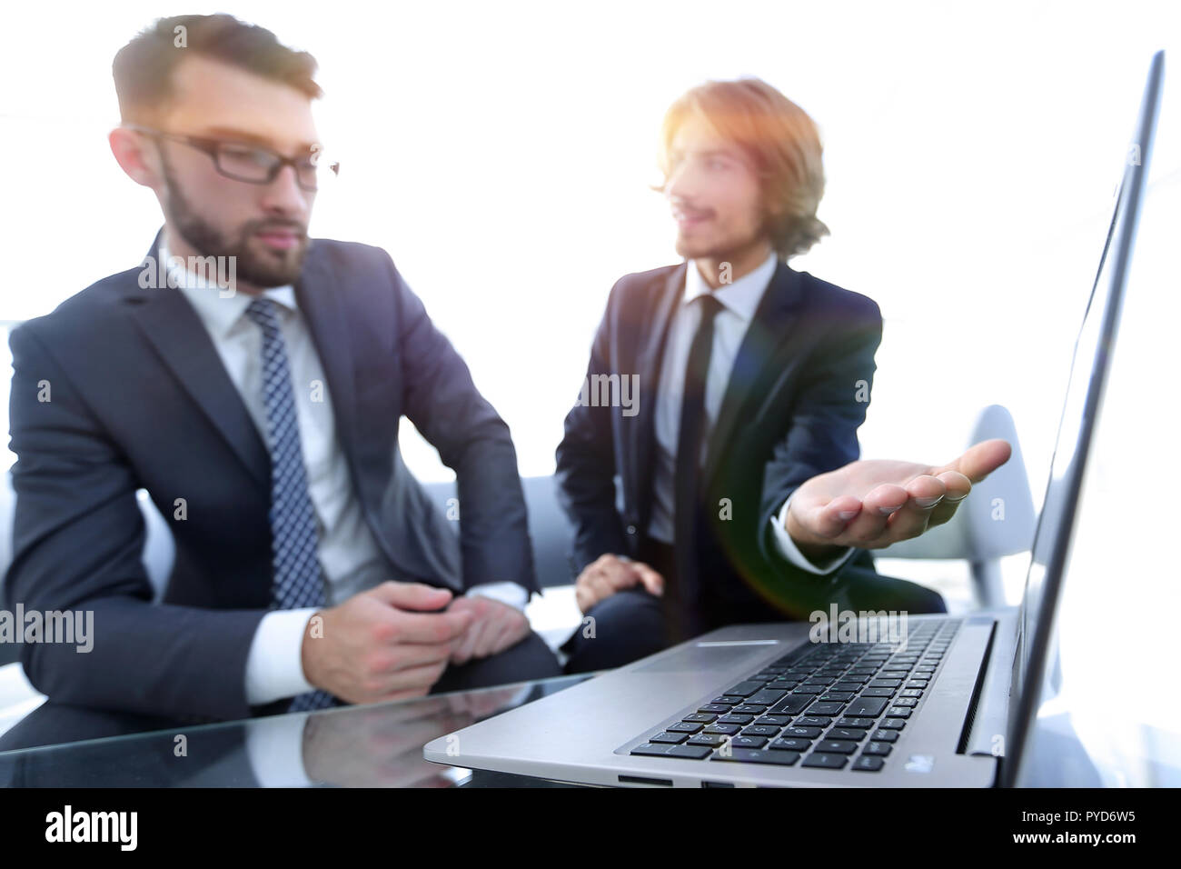 Two businessmen working on a project together Stock Photo - Alamy