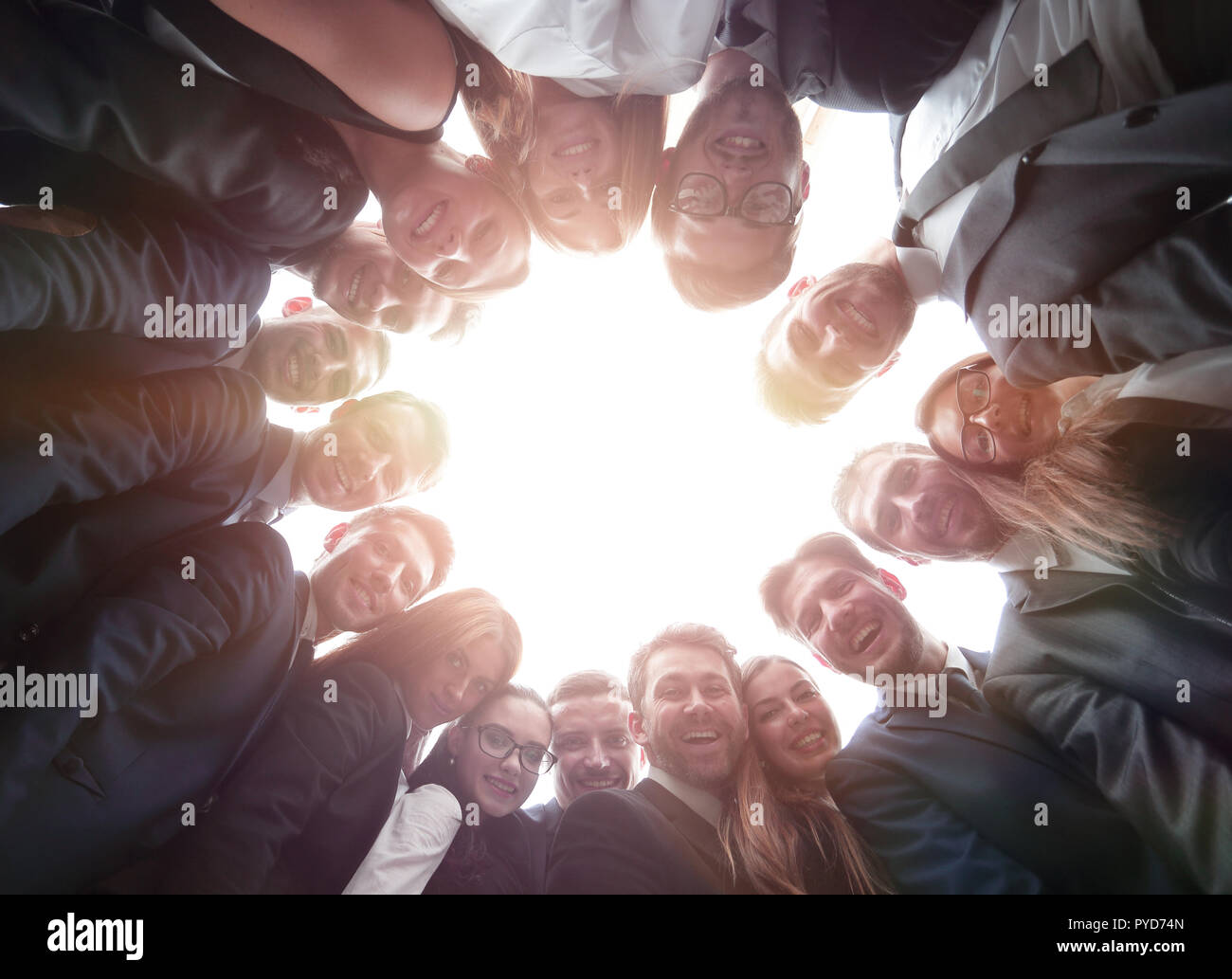 large business team is forming a circle and looking at the camera Stock ...