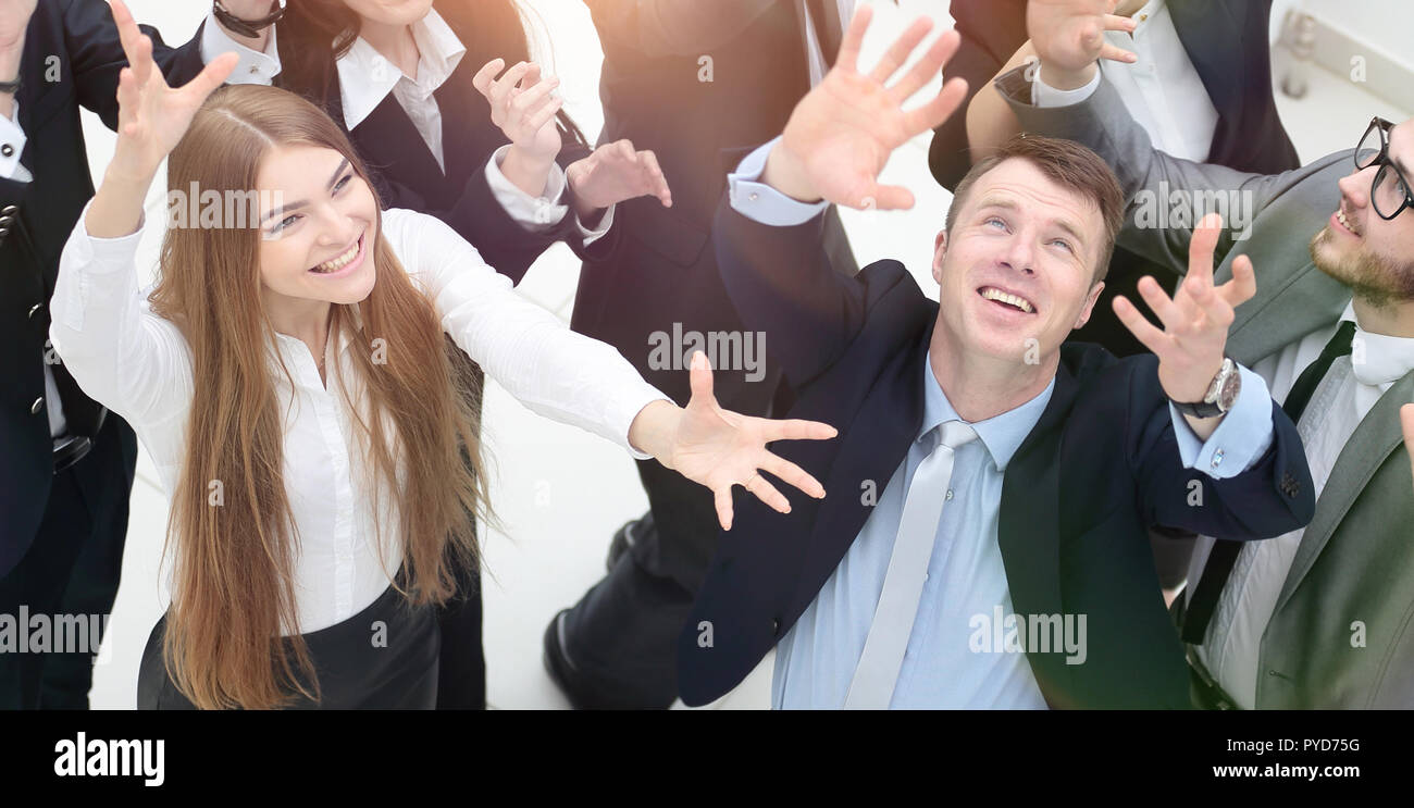 view from the top. joyful business team hands up Stock Photo - Alamy