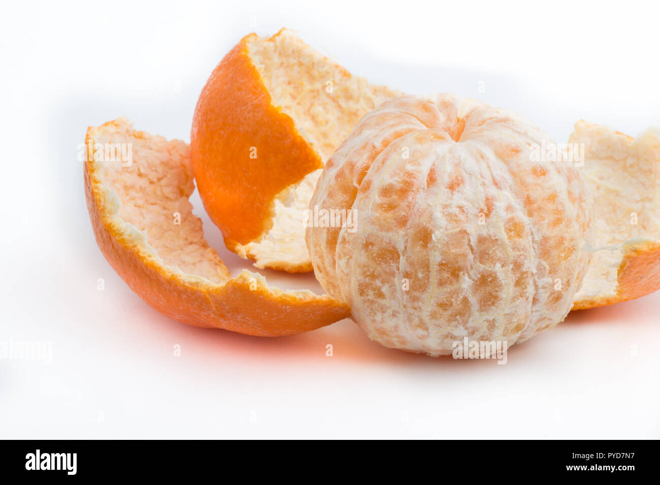 Close up of mandarin pieces on white background Stock Photo - Alamy