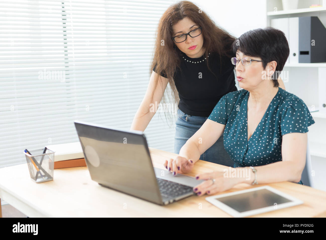 Technology, business and people concept - Young woman explaining ...