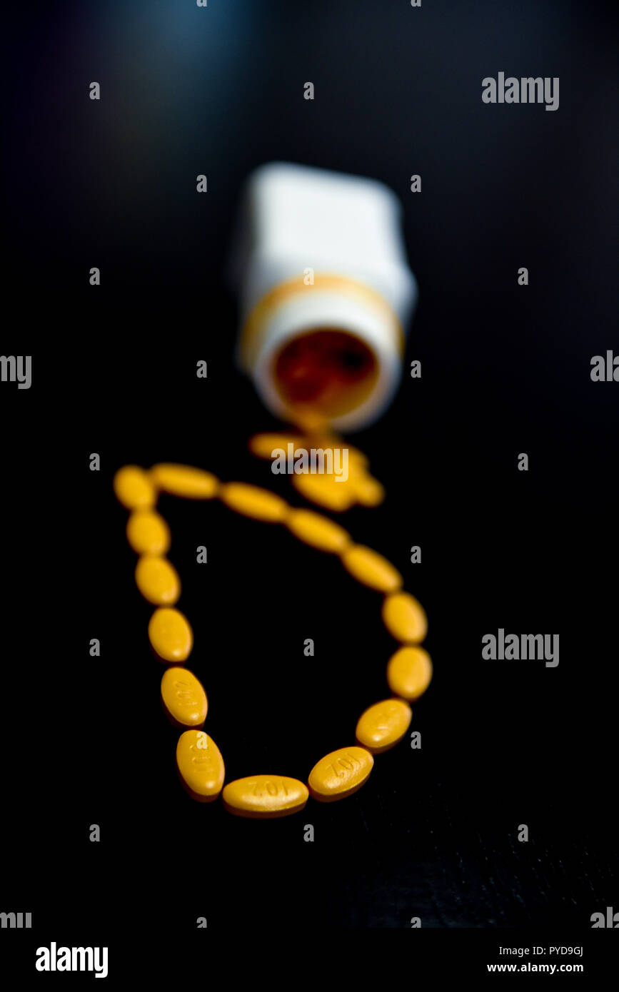 Top view of letter D made with yellow pharmaceutical pills Stock Photo ...
