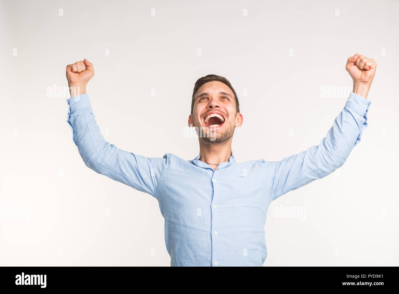 Emotions, victory and people concept - Handsome joyful man with his ...
