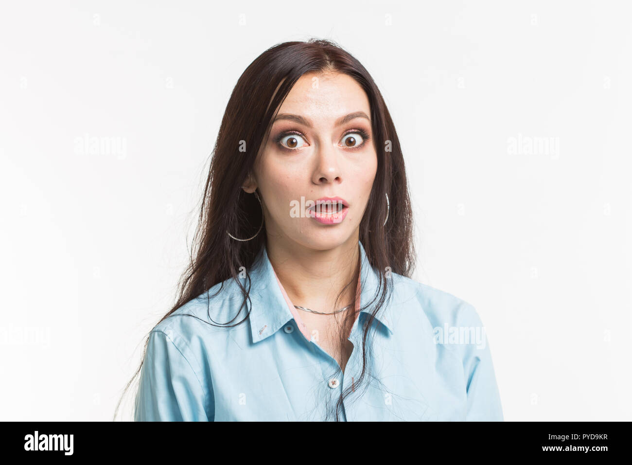 Emotions and people concept - young woman surprised and scared on white ...