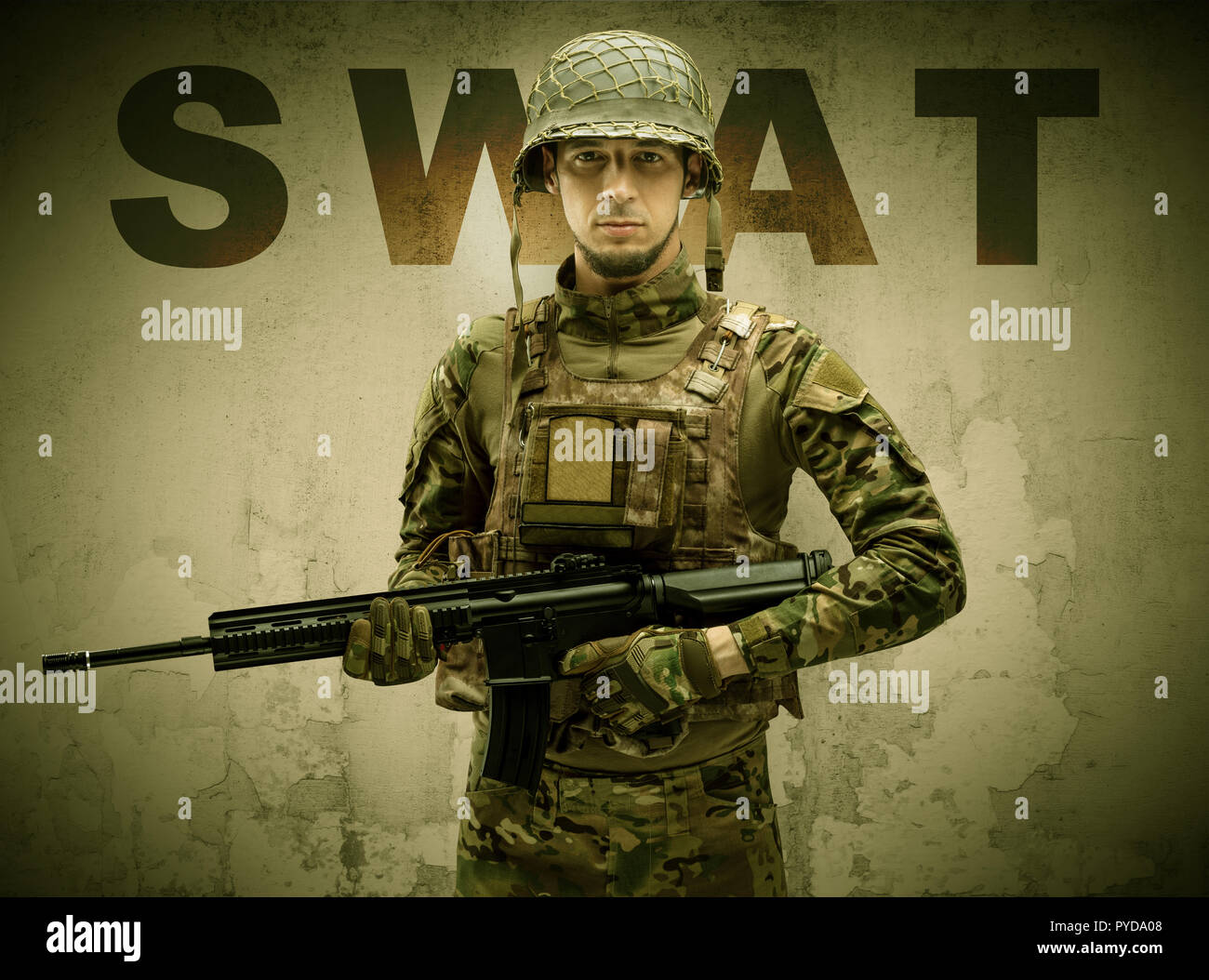 Uniformed armed soldier with damaged wall background Stock Photo - Alamy