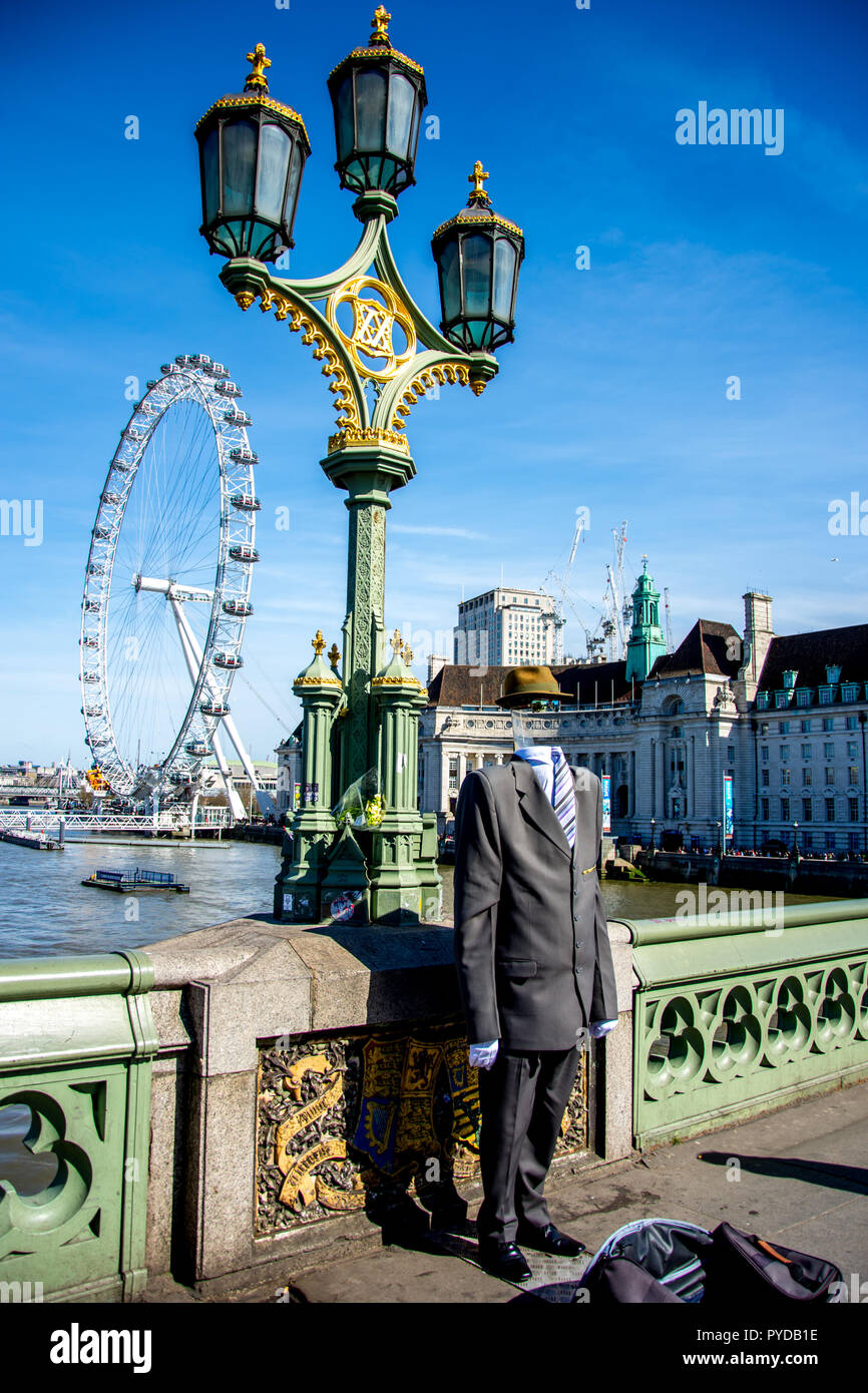 Street performer on Westminster Bridge and London Eye Stock Photo - Alamy