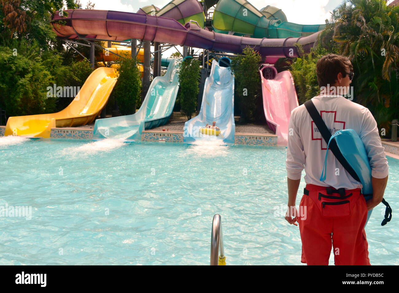 Orlando, Florida September 12 . Lifeguard and person enjoying in water ...
