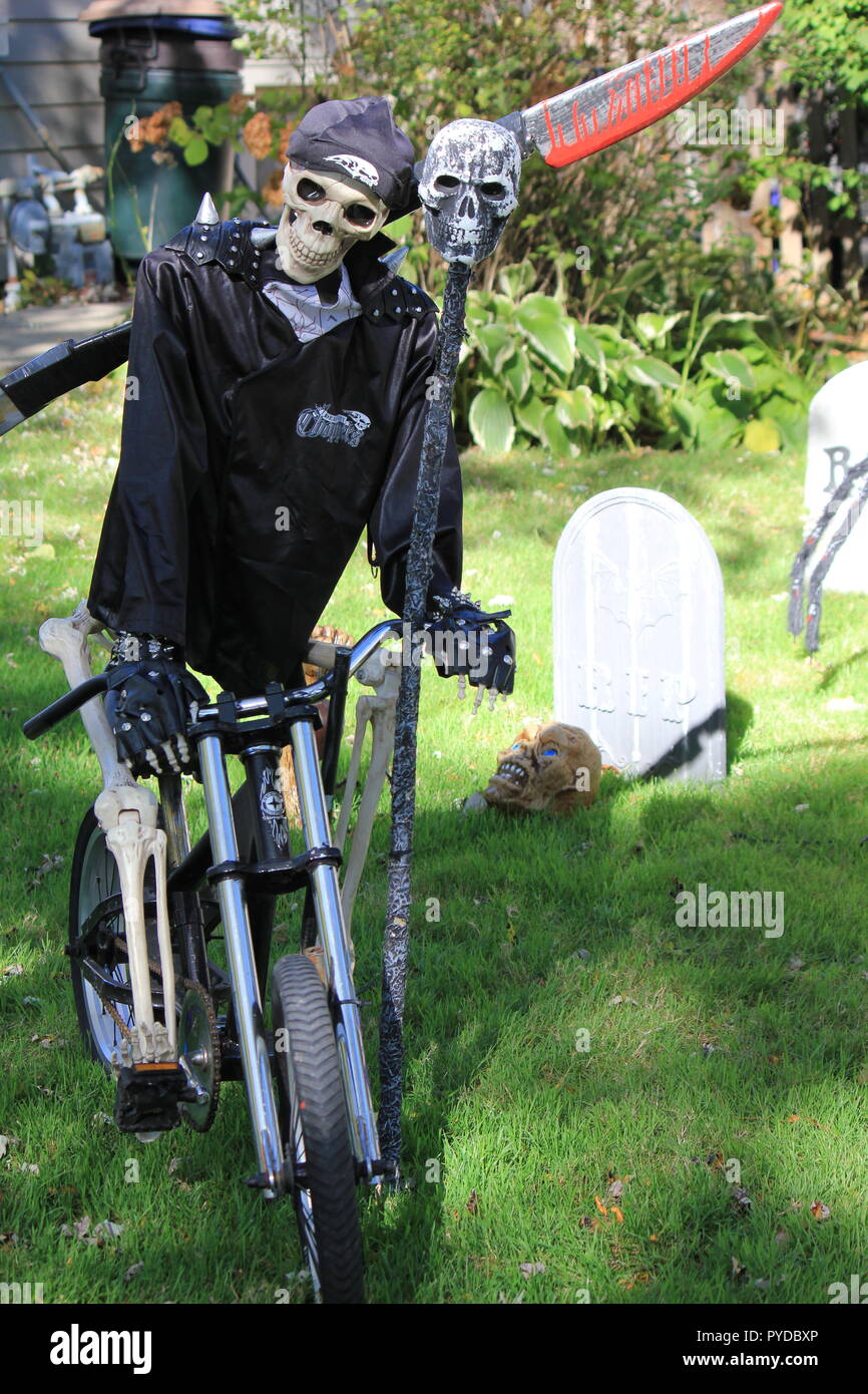 Biker on his motorcycle trailblazer with sinister props as creative ...