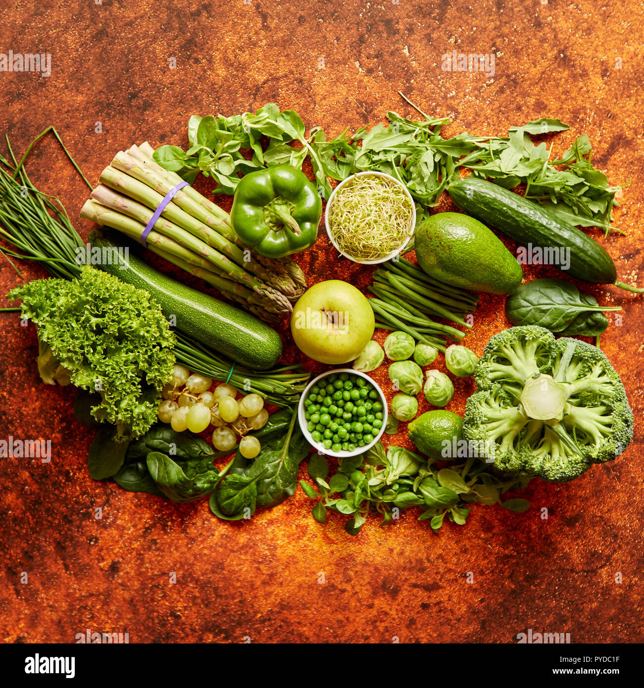 Fresh, natural, green vegetables, fruits and herbs assortment placed on ...