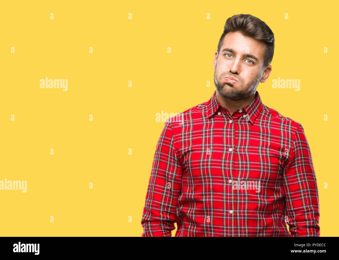 Young handsome man over isolated background puffing cheeks with funny ...