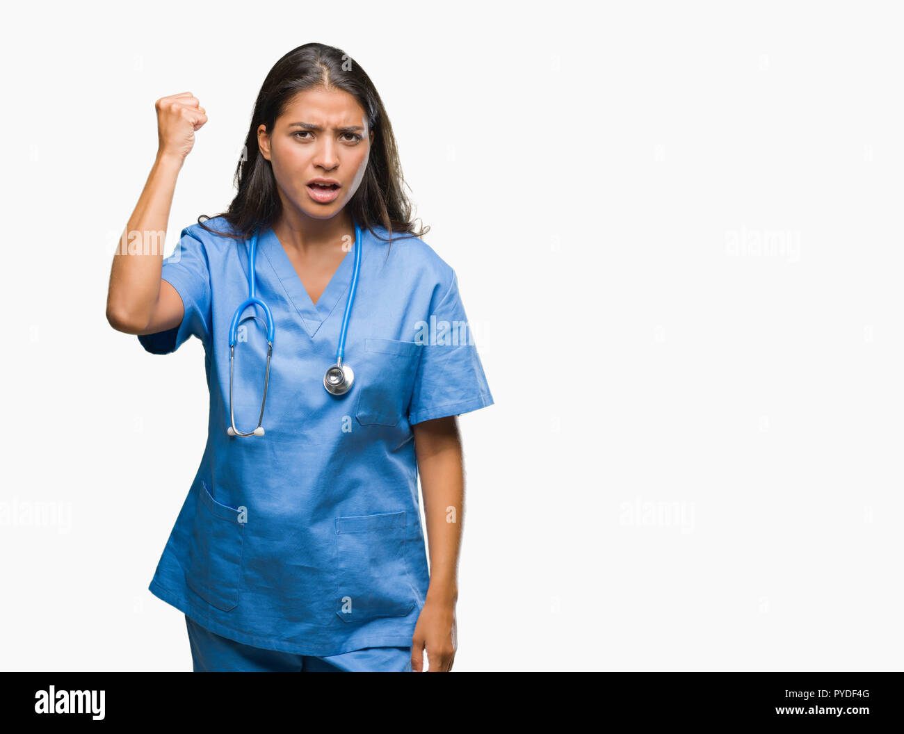 Young arab doctor surgeon woman over isolated background angry and mad ...