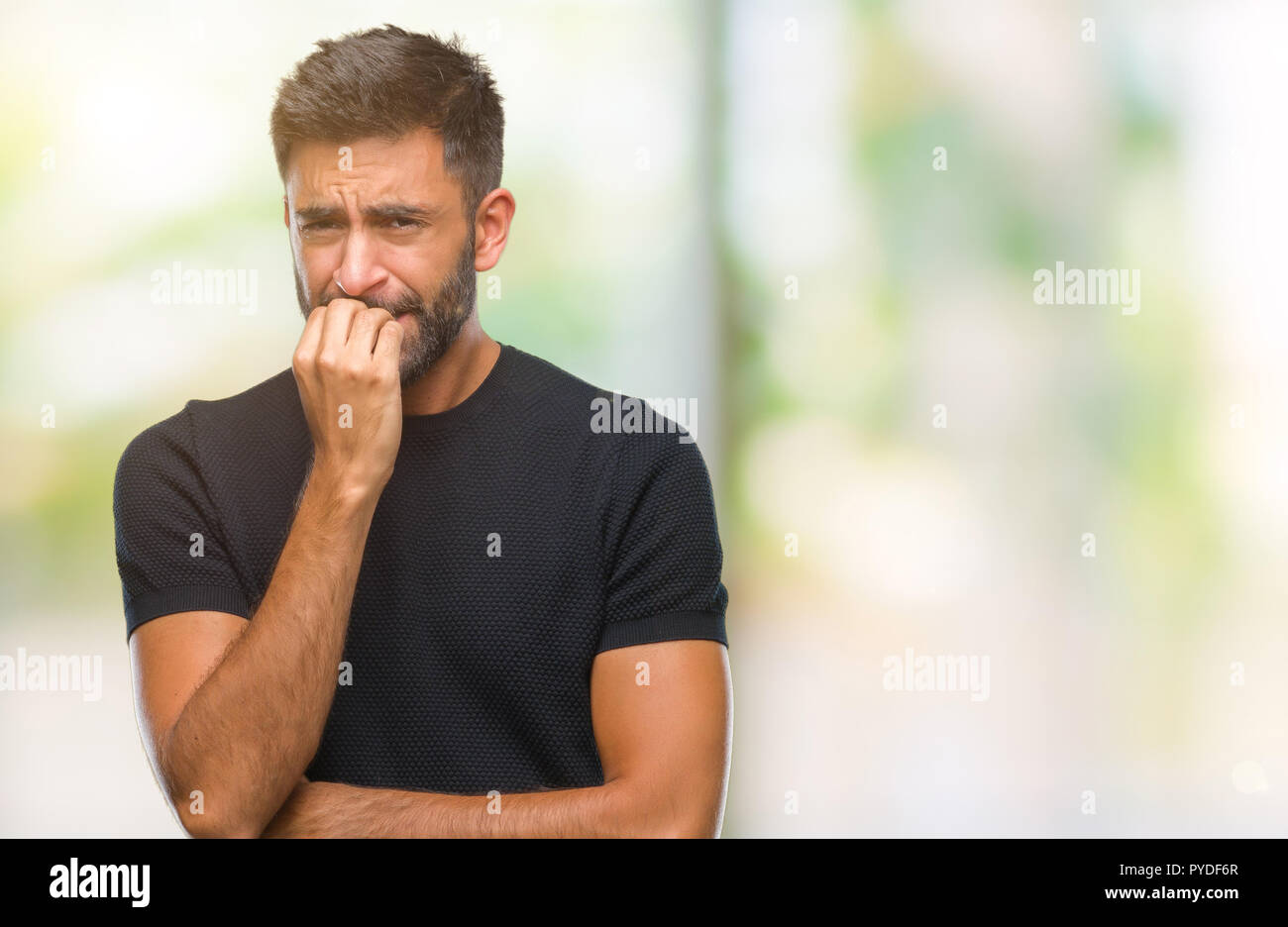 Adult hispanic man over isolated background looking stressed and ...
